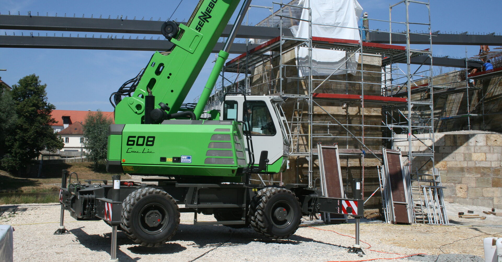 SENNEBOGEN 608 MULTICRANE USED FOR RESTORATION OF THE STONE BRIDGE